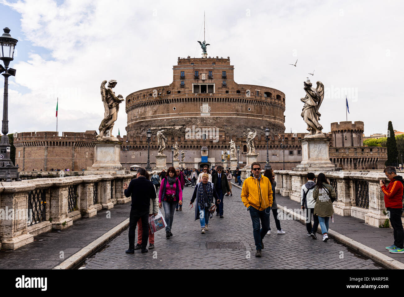ROME, ITALY - JUNE 28, 2019: crowd of people walking on street near old ...