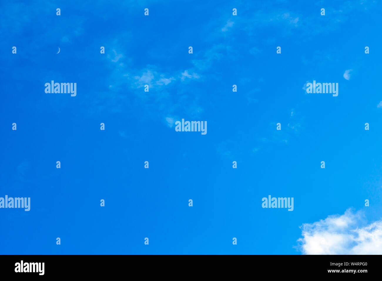 The blue sky with the Moon on left corner Stock Photo - Alamy