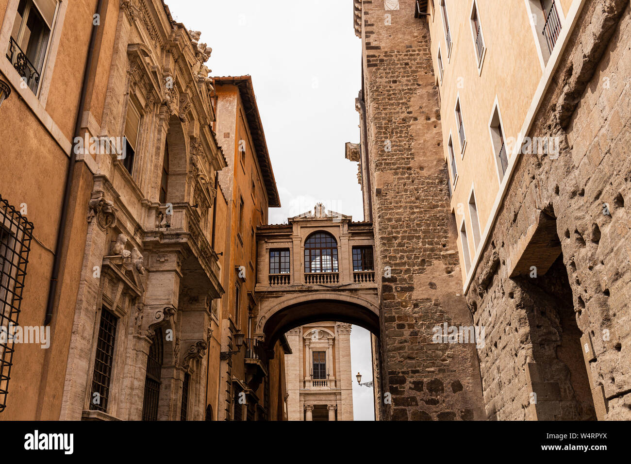 old buildings with bas-reliefs under grey sky in rome, italy Stock ...
