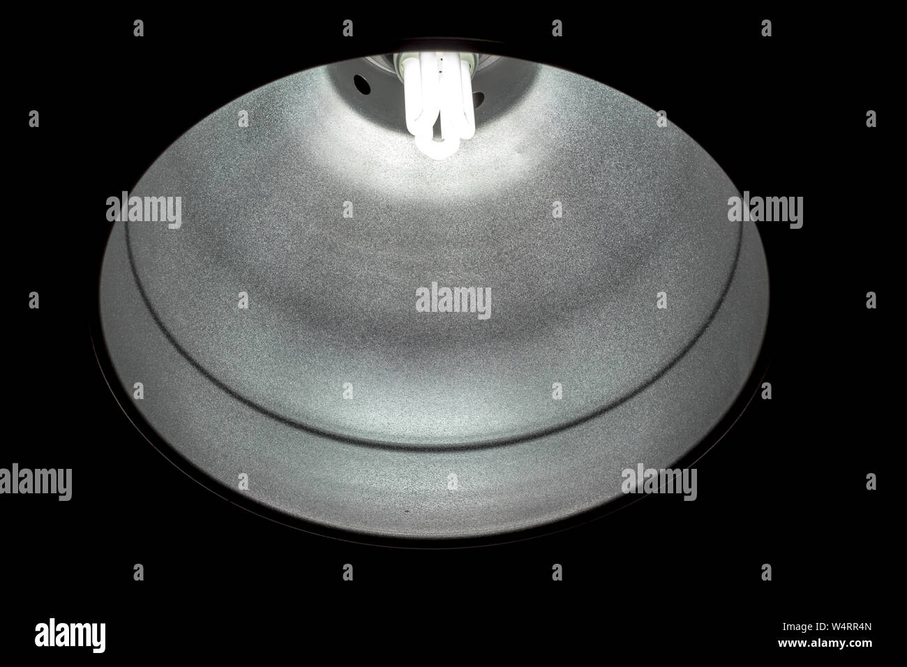 Light from a light bulb dangling above Stock Photo - Alamy