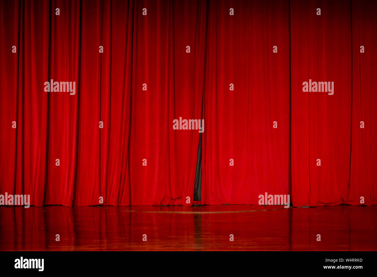 Red curtains in a theater scene of the show Stock Photo - Alamy