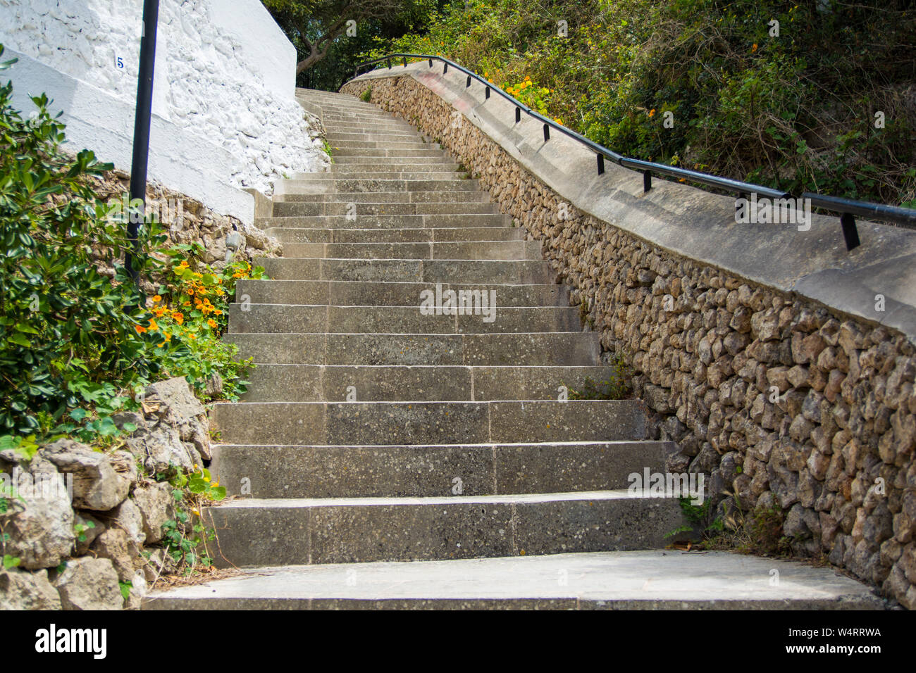 Set of stairs disappearing around the corner of a building Stock Photo ...