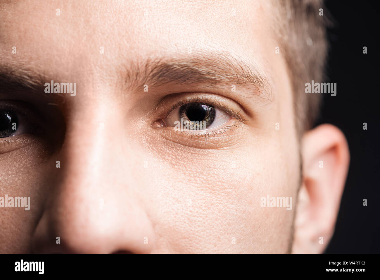 close up view of adult man eyes with eyelashes and eyebrows looking at ...