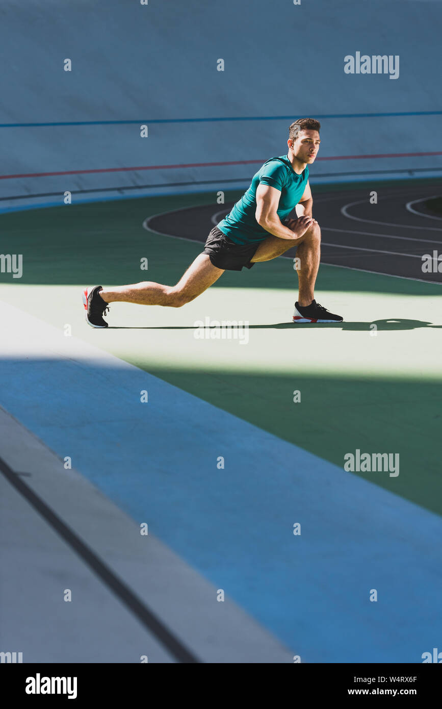 Muscular sportsman doing lunges in hi-res stock photography and images ...