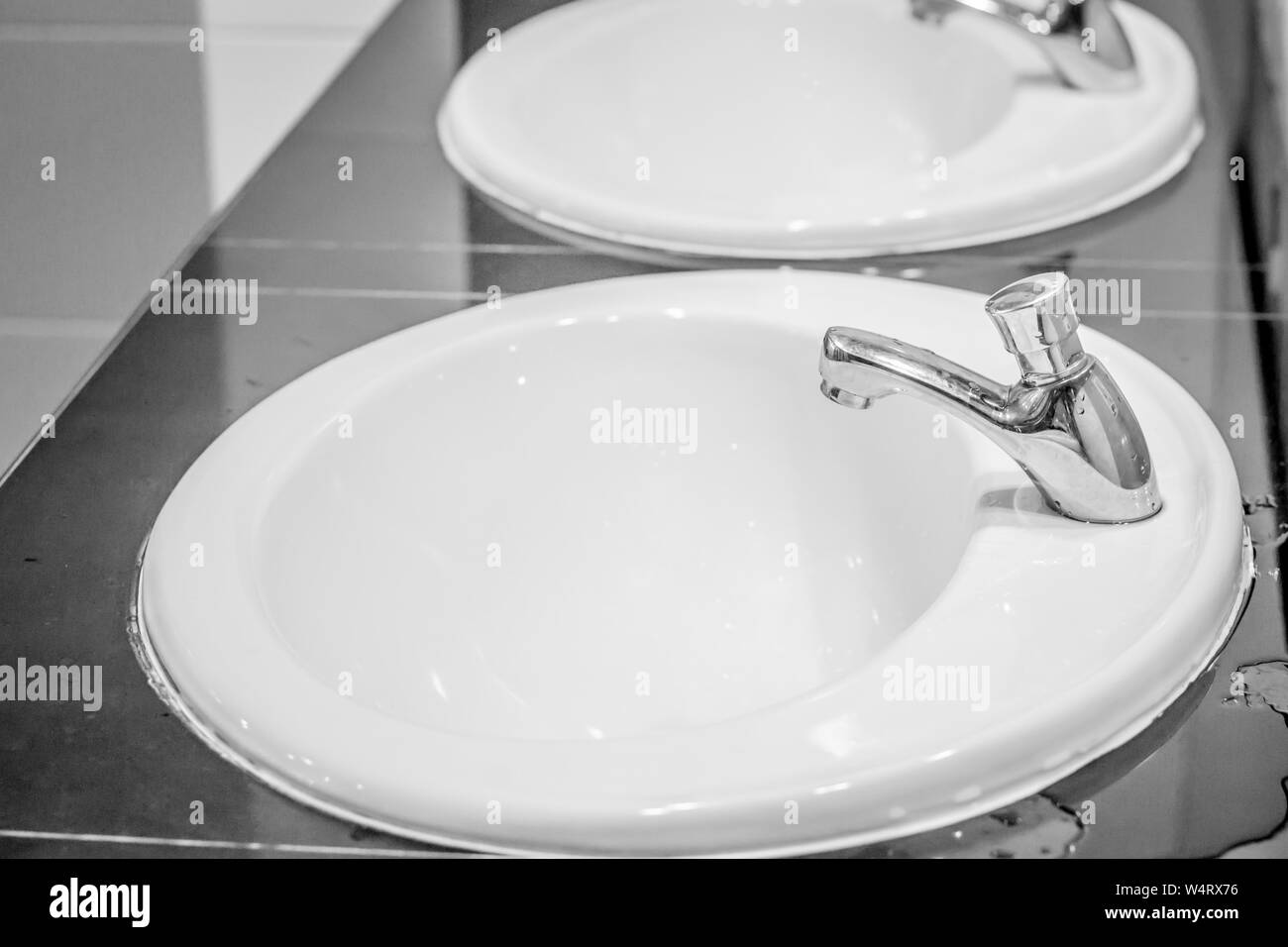 White basin in the bathroom in the house Stock Photo - Alamy