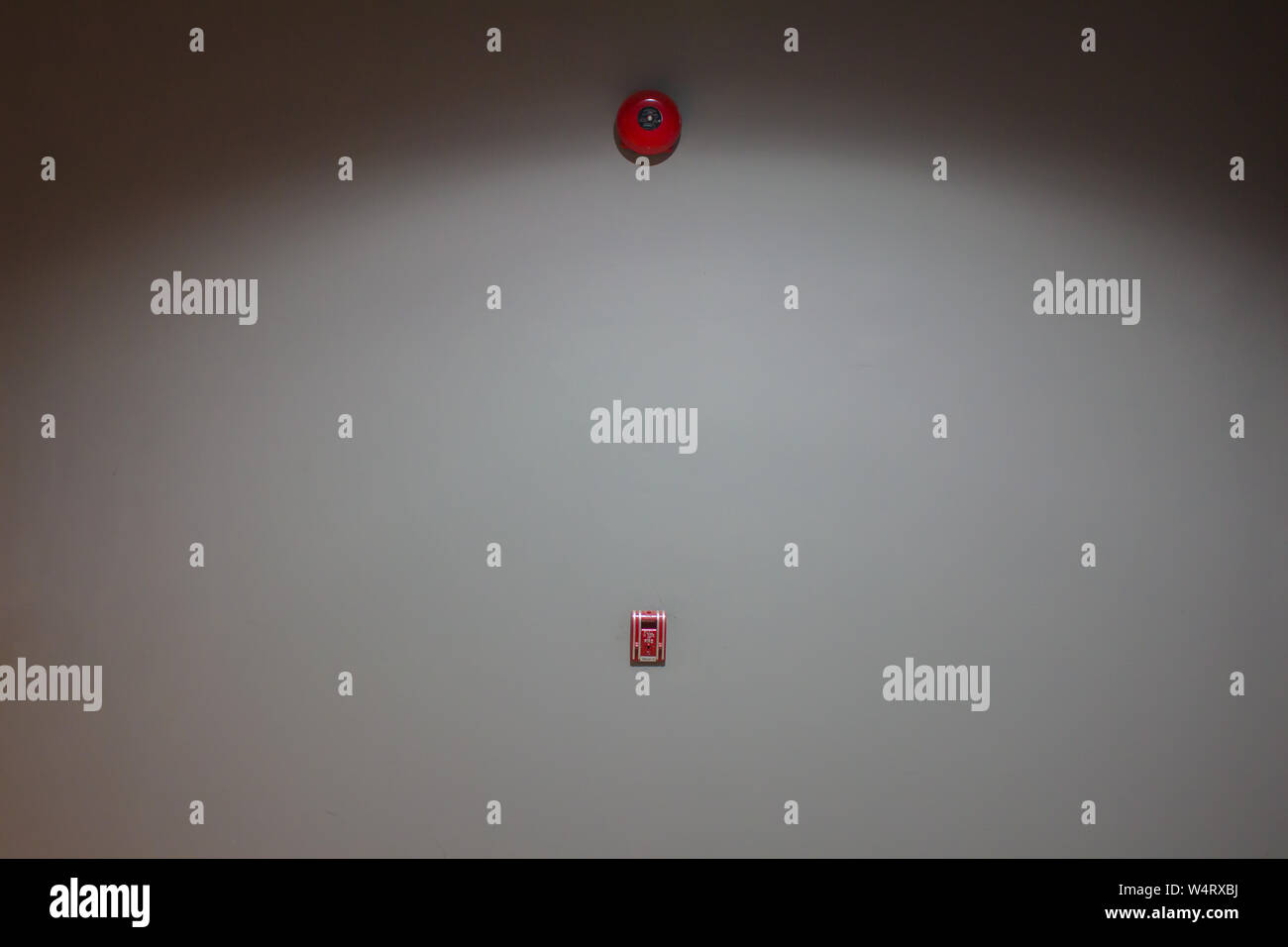 Fire alarm with the background gray walls Stock Photo - Alamy