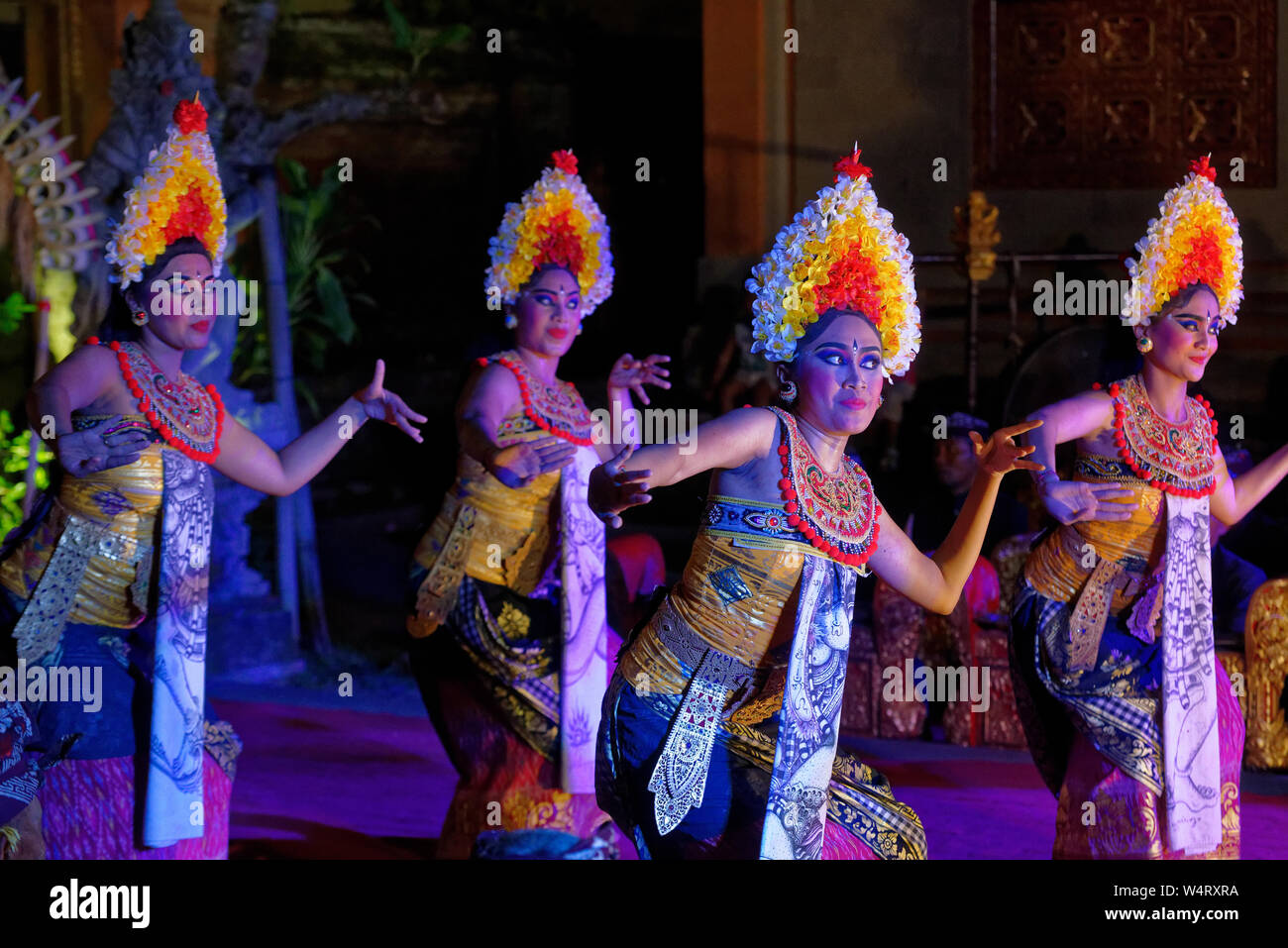 Troup of 4 traditional woman dancers performing at Ubud Palace, Bali ...