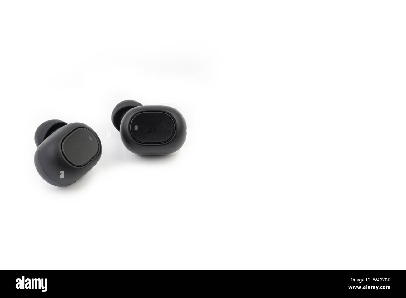 Wireless earbuds or earphones on white background Stock Photo - Alamy