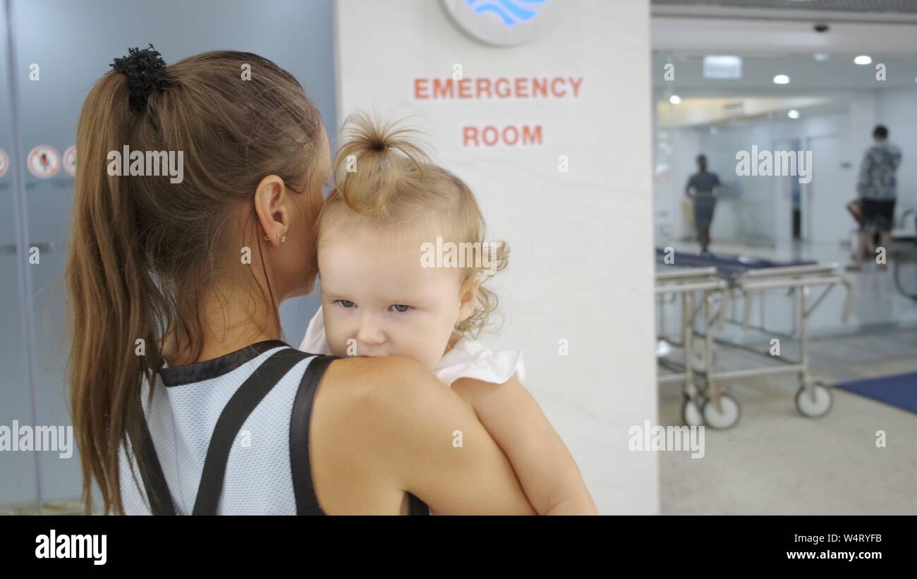 Mom and child come in in the emergency room at the hospital in Pattaya ...