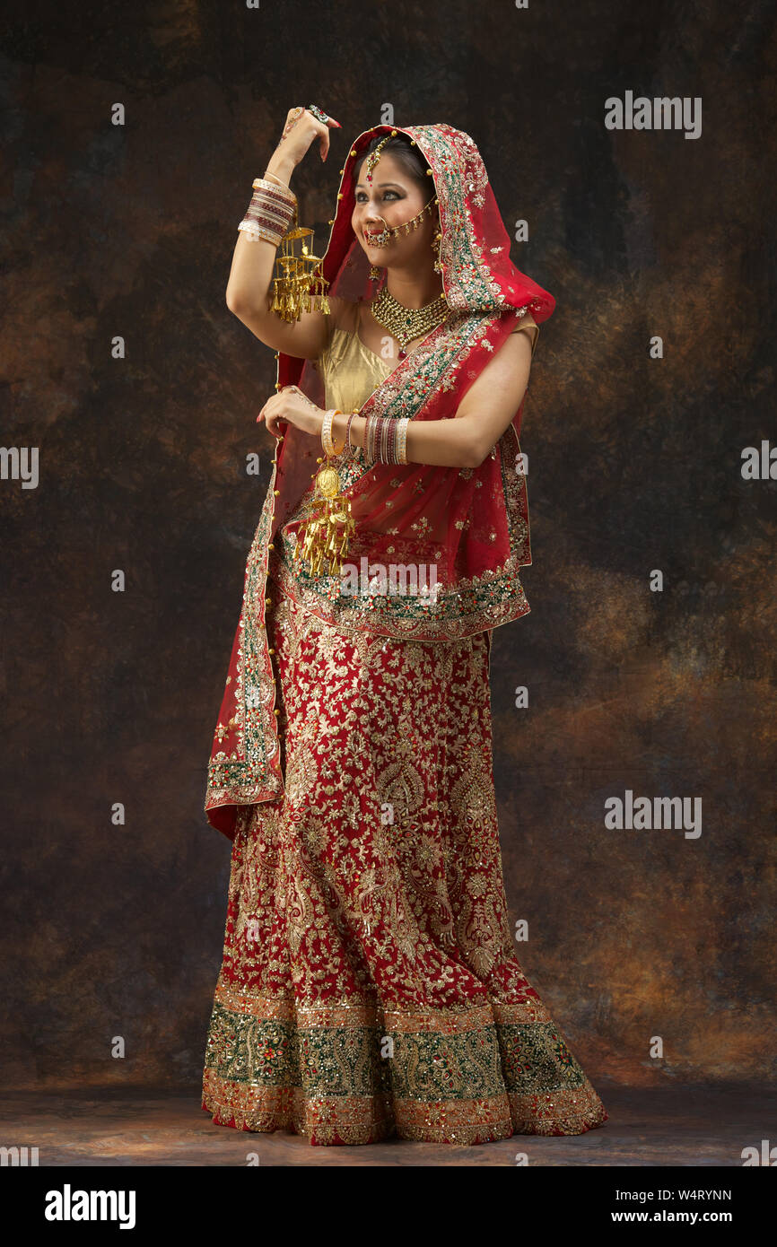 Punjabi bride standing Stock Photo - Alamy