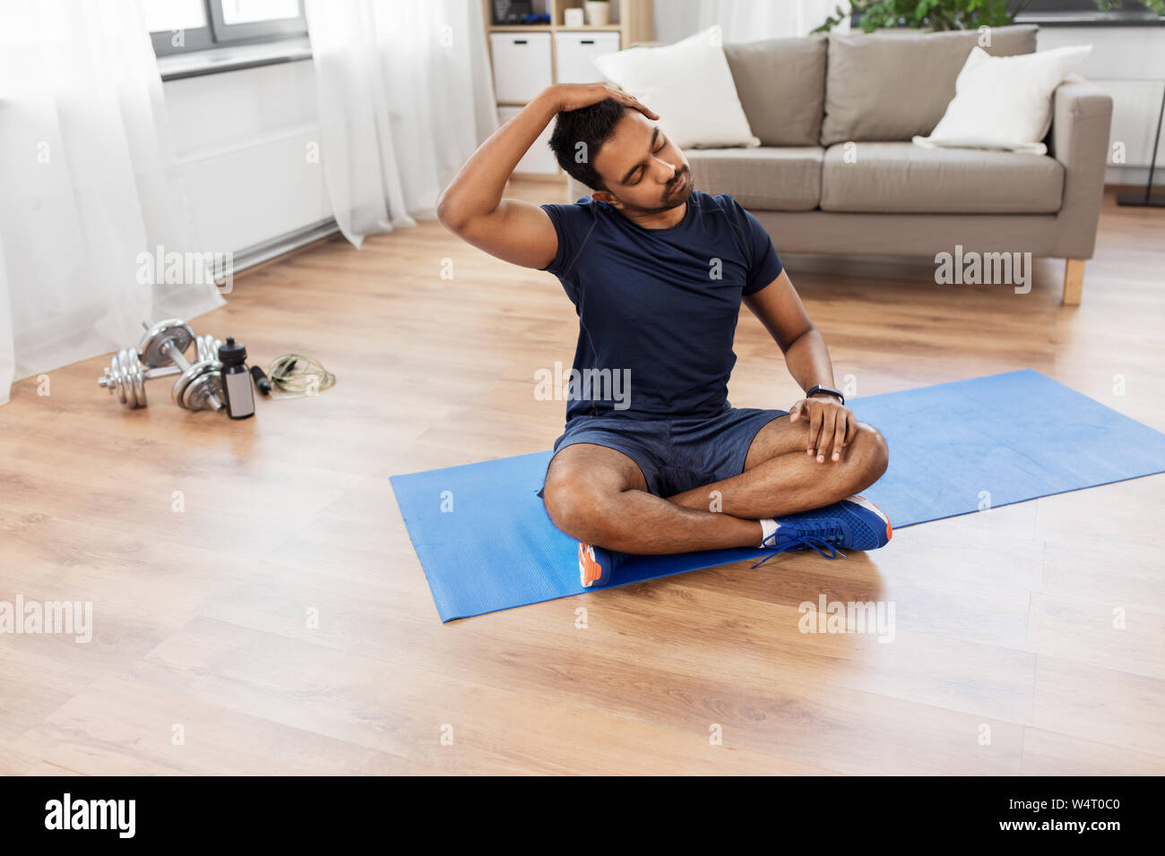 man training and stretching body at home Stock Photo - Alamy