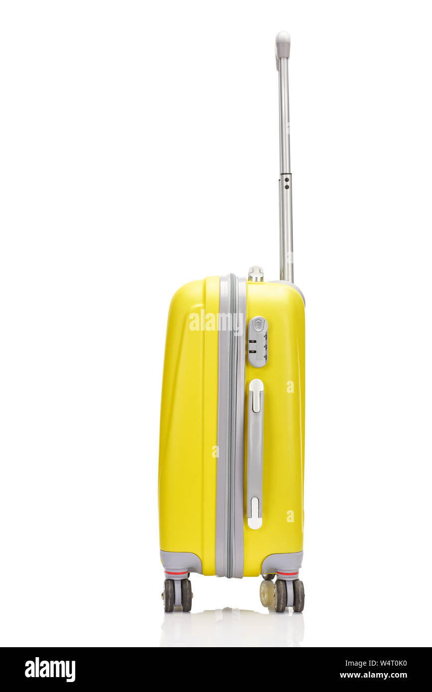 side view of yellow plastic wheeled colorful suitcase with handle ...