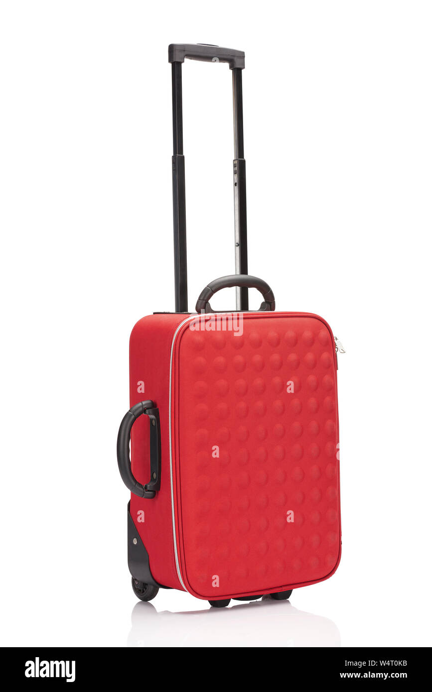 red textured colorful suitcase with handle on wheels isolated on white ...