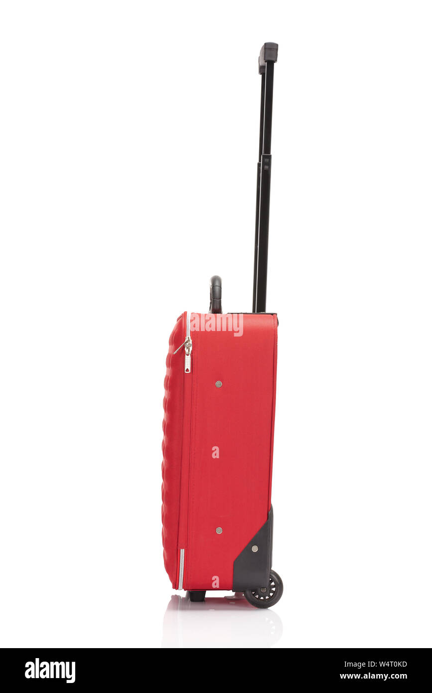 side view of red wheeled textured colorful suitcase with handle ...