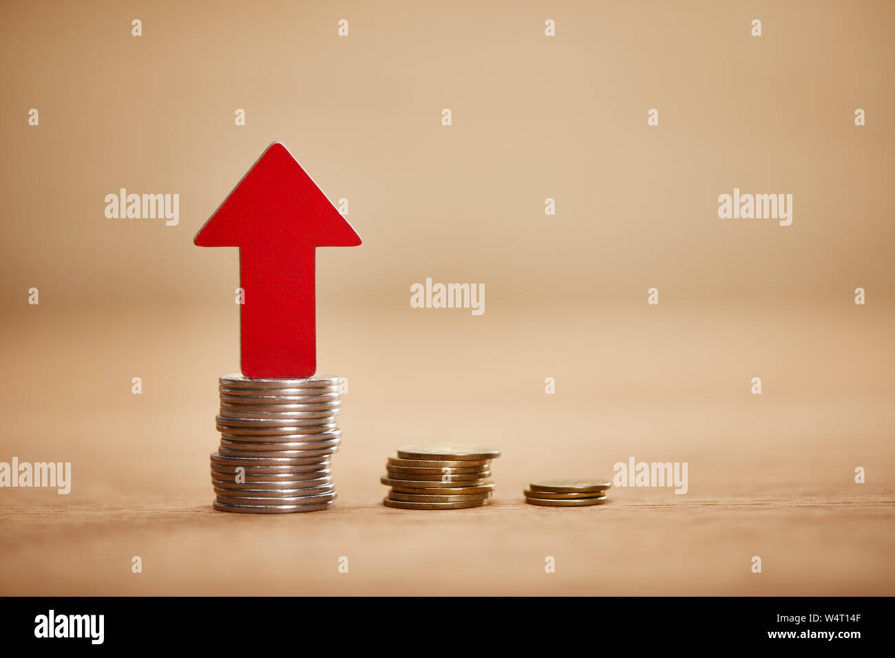 increasing chart made of coins with red arrow upwards, financial growth ...