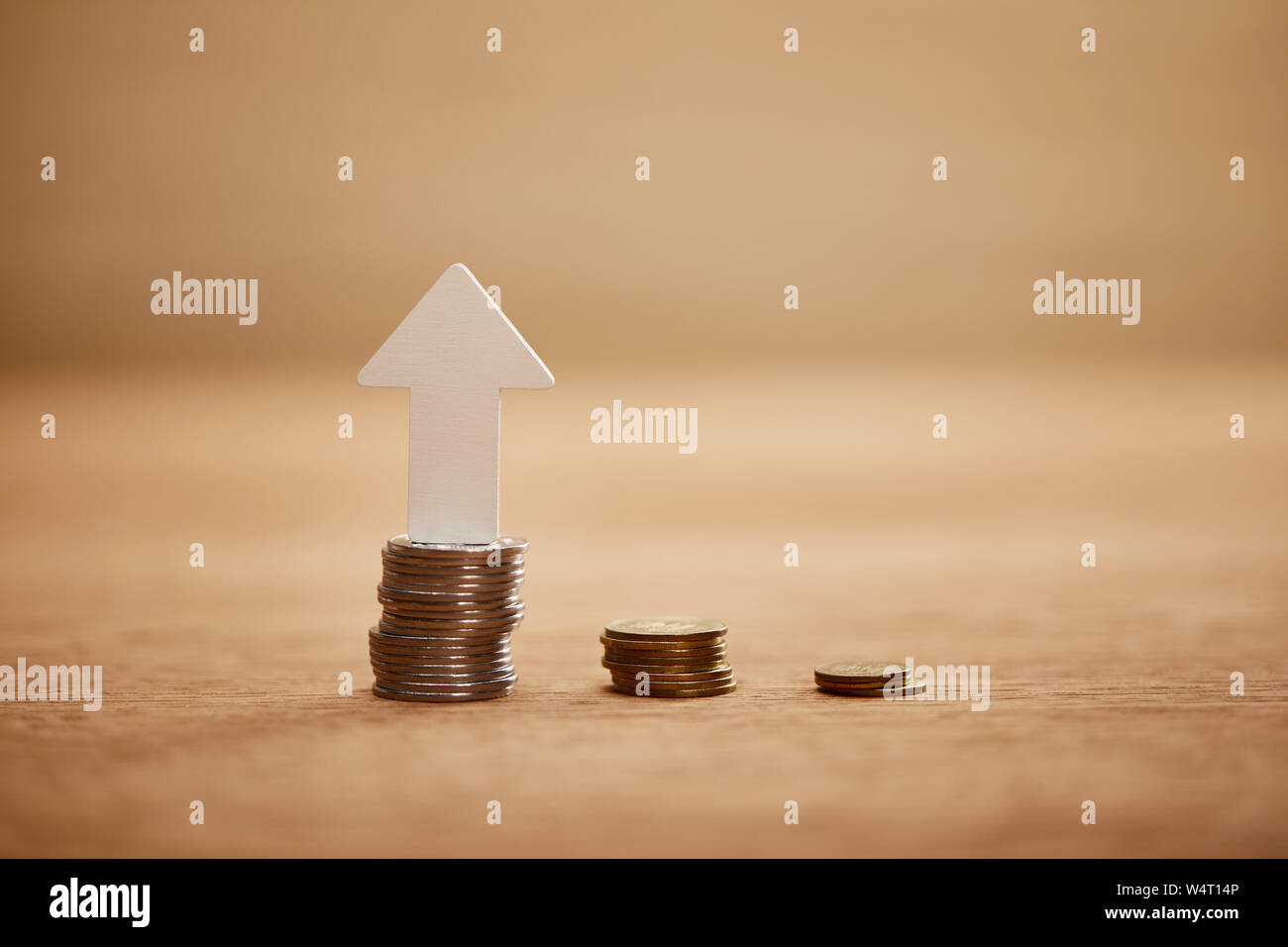 increasing chart made of coins with white arrow, financial growth ...