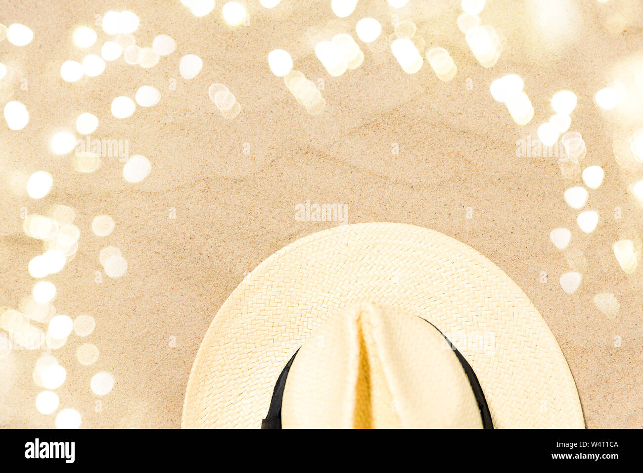 straw hat on beach sand Stock Photo - Alamy