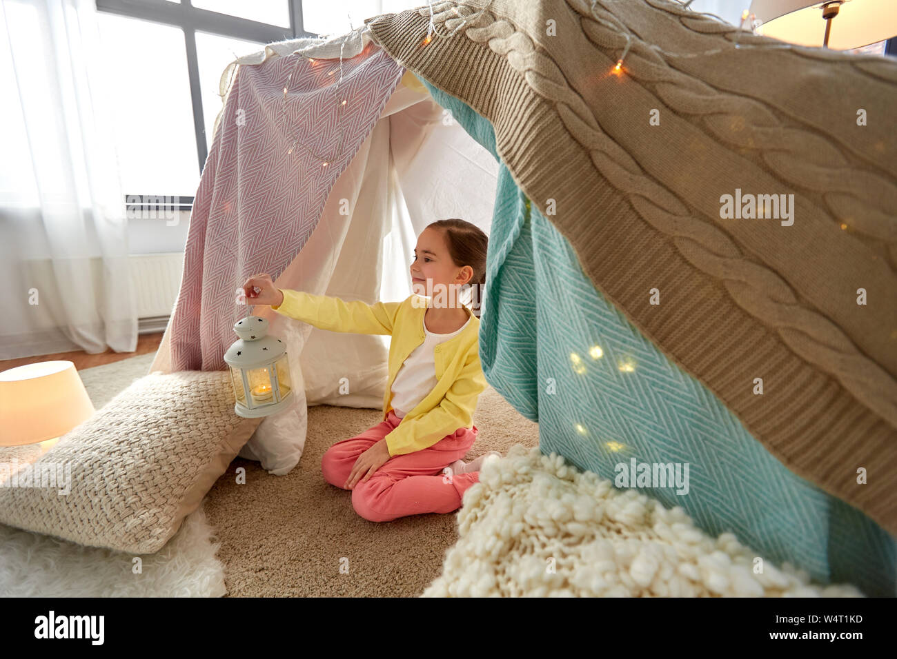 little girl with lantern in kids tent at home Stock Photo - Alamy