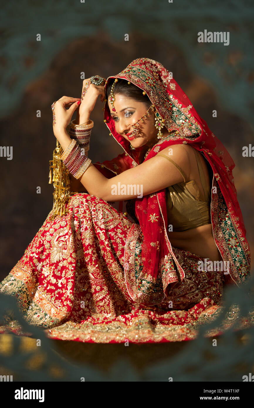 Punjabi bride sitting Stock Photo - Alamy
