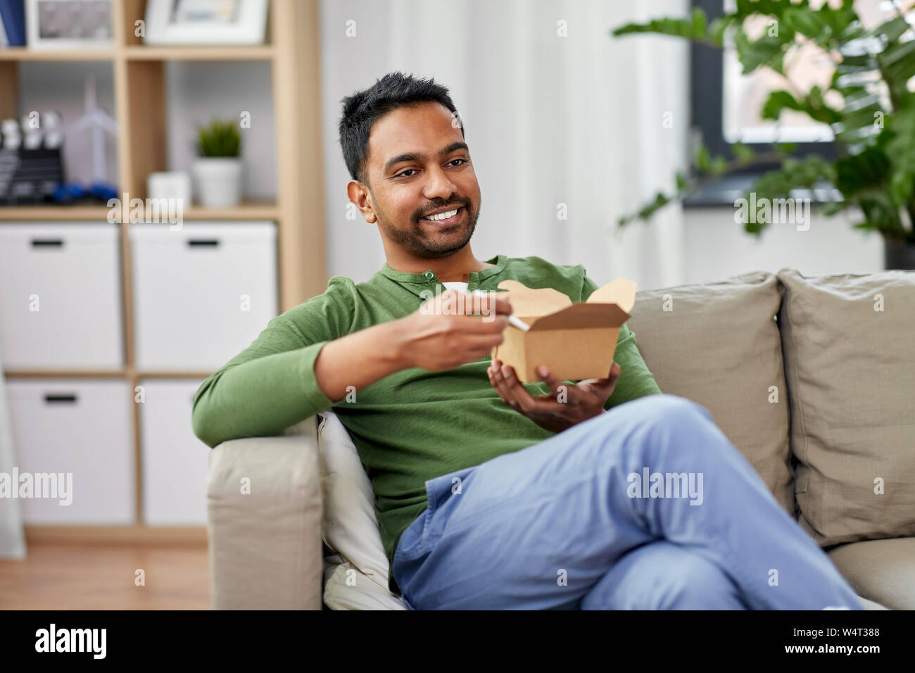 Indian man eating hi-res stock photography and images - Alamy
