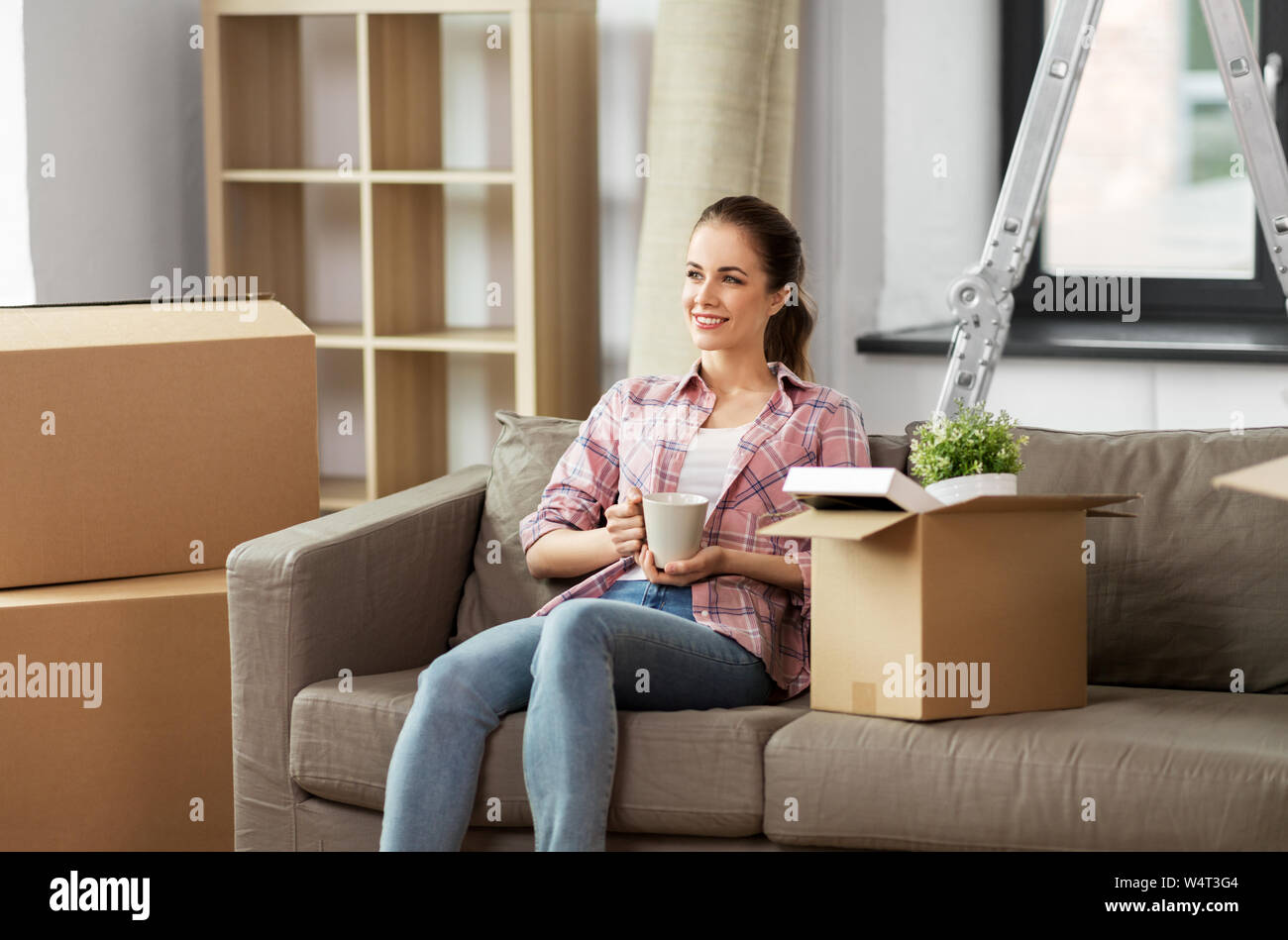 woman moving to new home and drinking coffee Stock Photo - Alamy