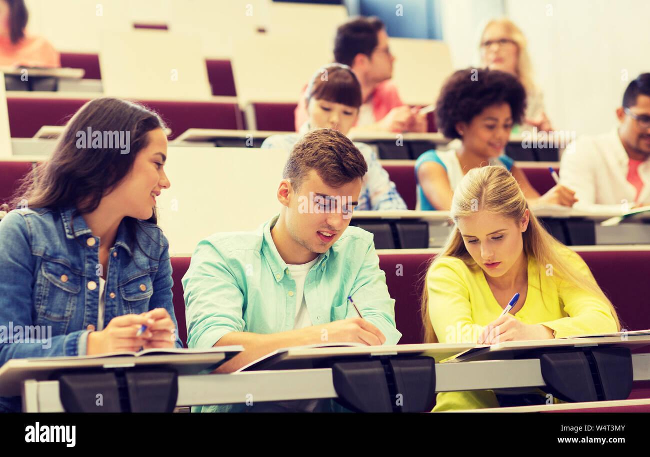 group of students with notebooks in lecture hall Stock Photo - Alamy