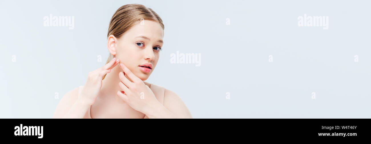 upset teenage girl touching pimple on face, panoramic shot Stock Photo ...