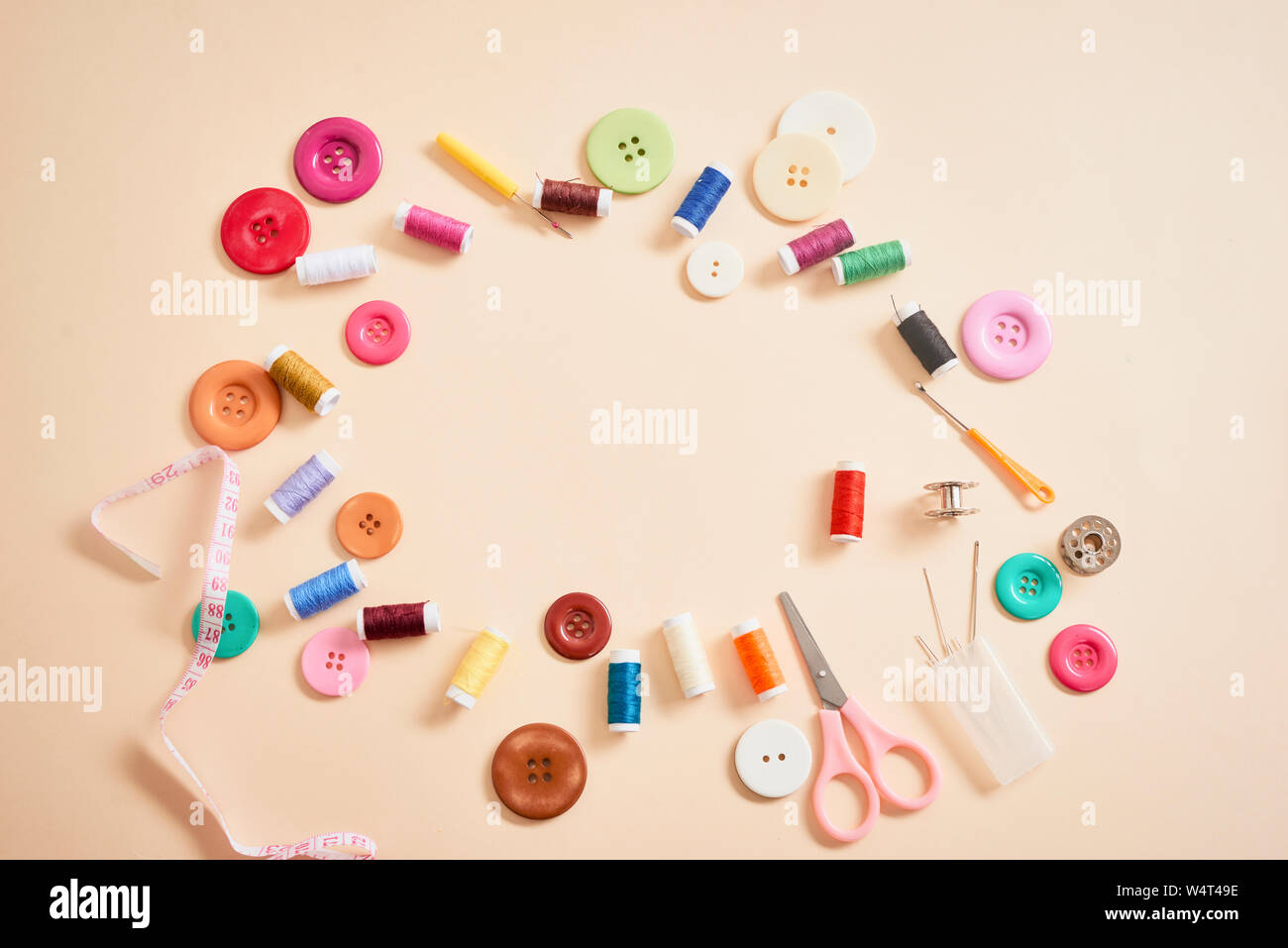 tools for needlework thread scissors and tape measure isolated on biege ...