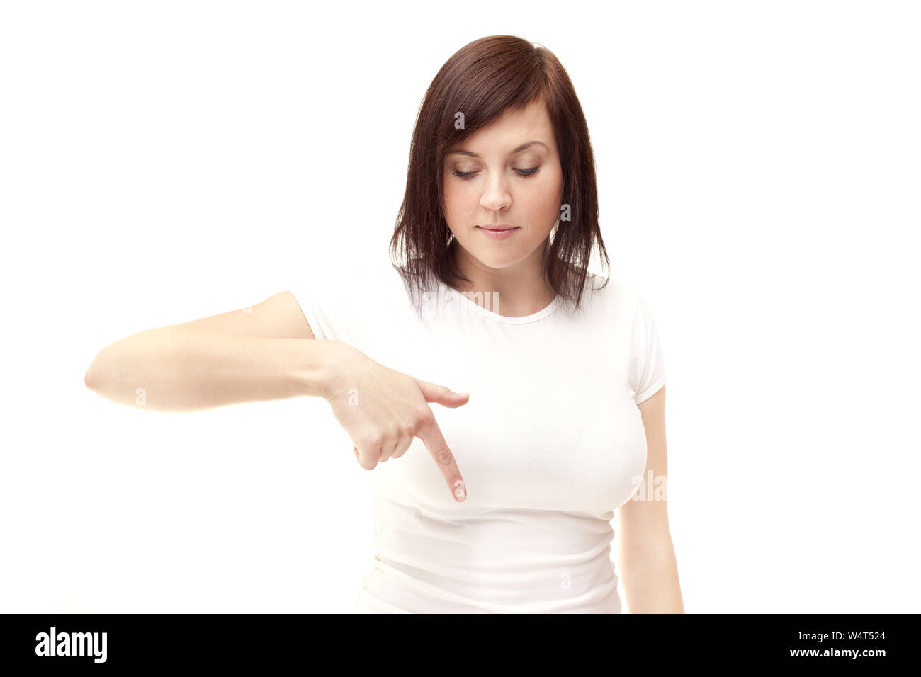 Girl in white t-shirt shows down isolated on white background Stock ...