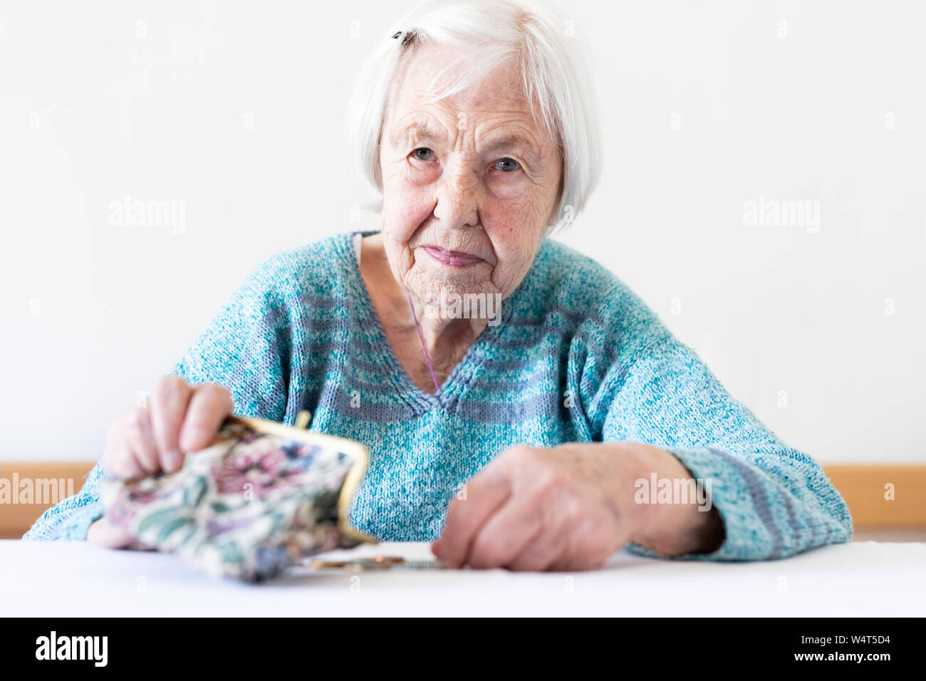 Woman counting coins hi-res stock photography and images - Alamy