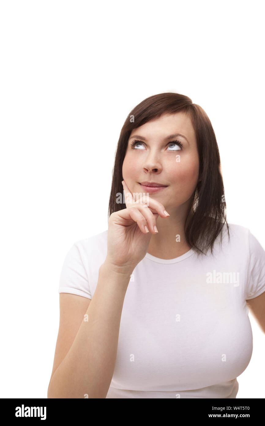 serious young woman thinking about something and looking up. Studio ...