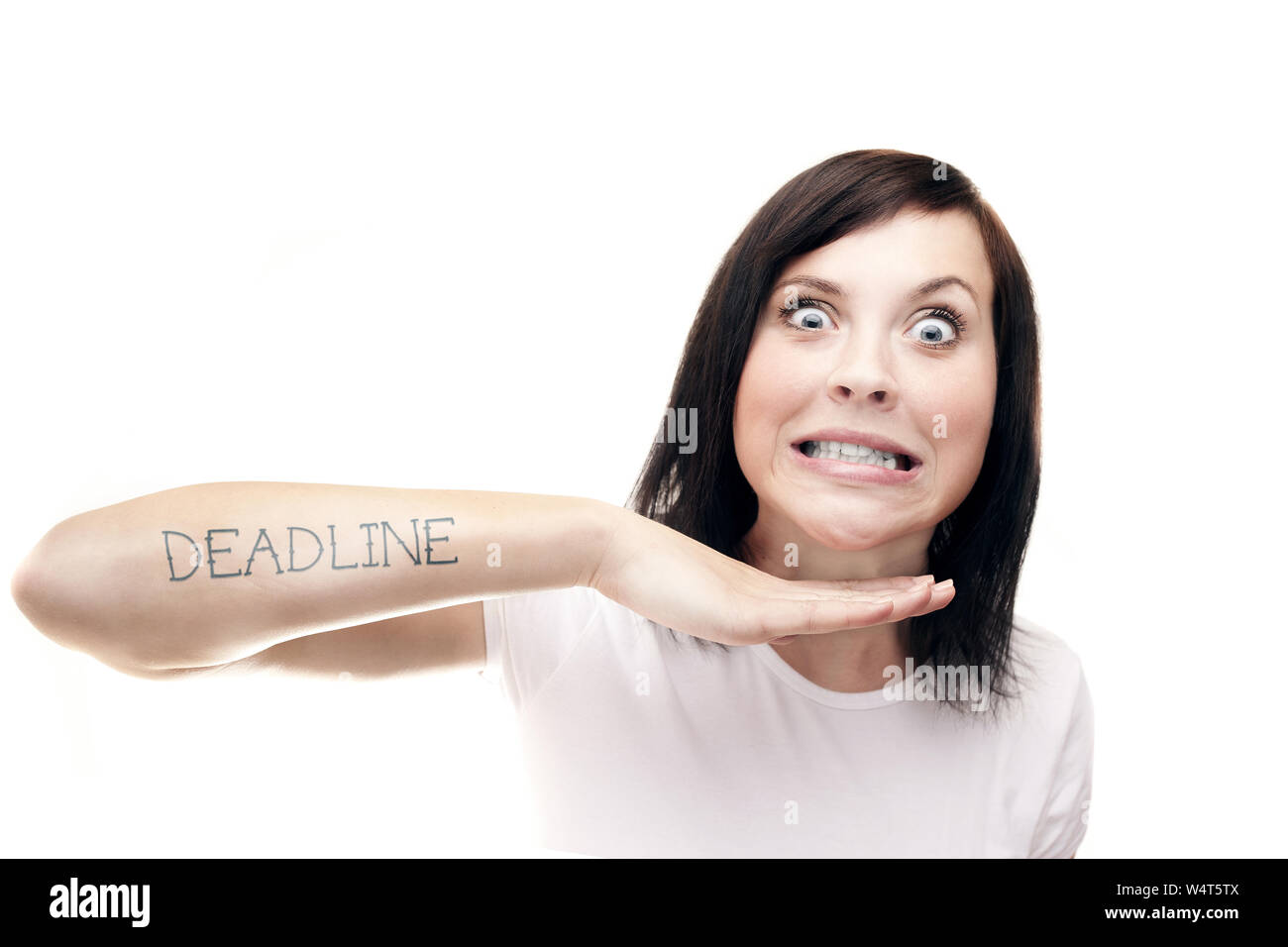 Woman wíth tattoo deadline and crazy face Stock Photo - Alamy