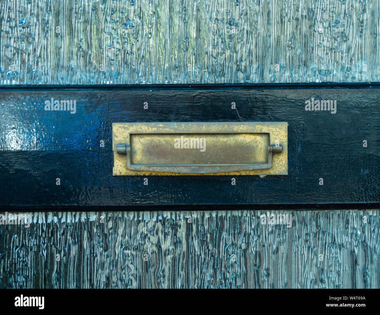 Old letterbox in the door, traditional way of delivering letters to the ...