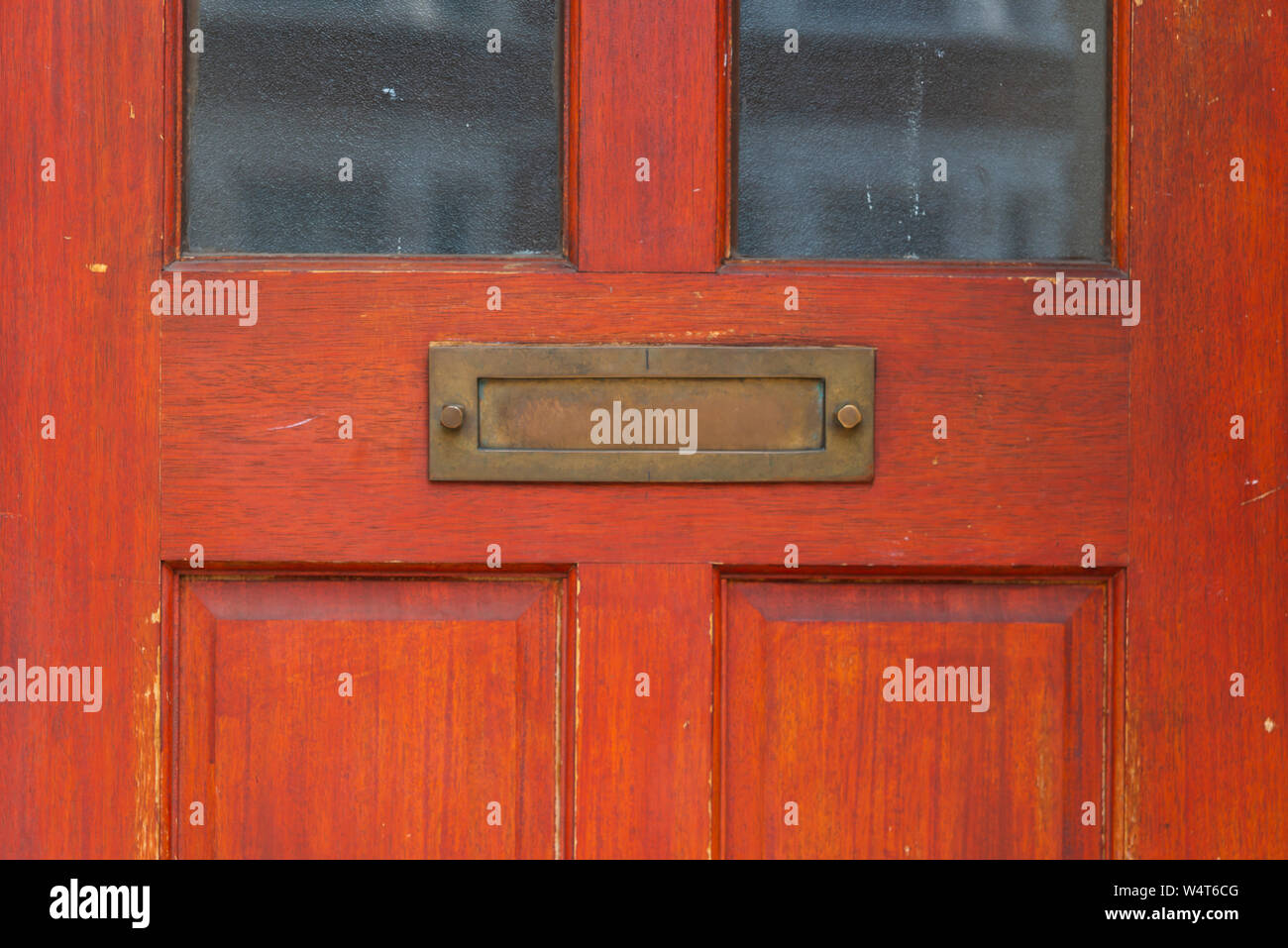 Old letterbox in the door, traditional way of delivering letters to the ...