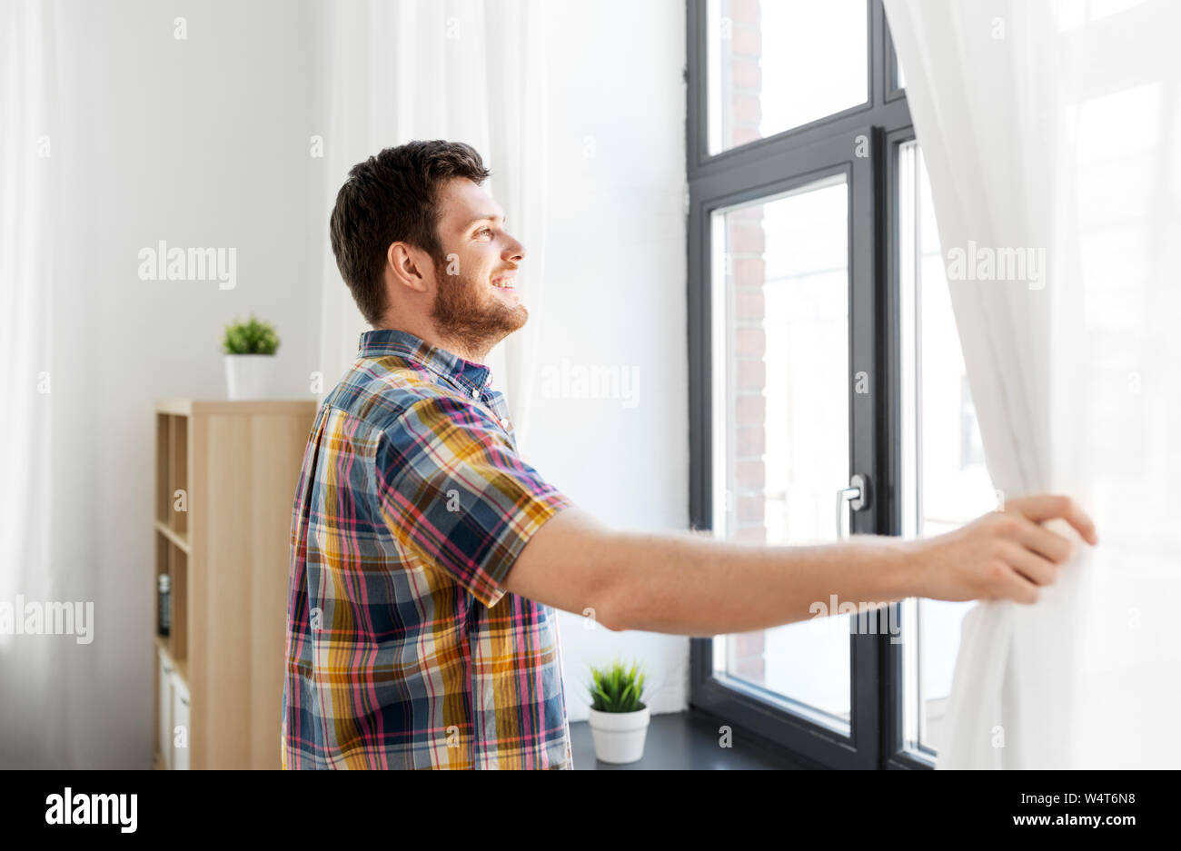 Man opening window hi-res stock photography and images - Alamy