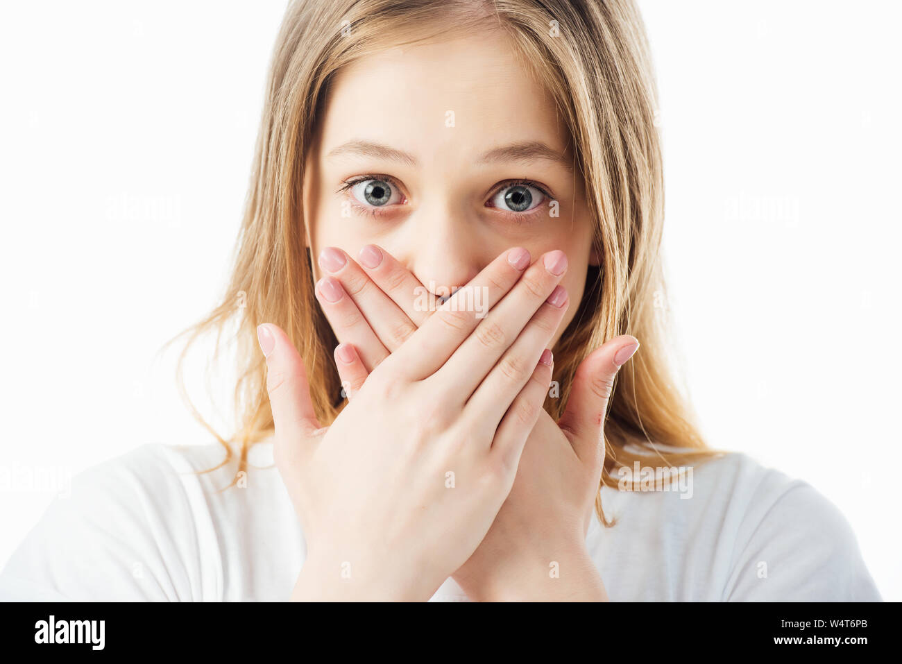 scared teenage girl covering mouth with hands isolated on white Stock ...