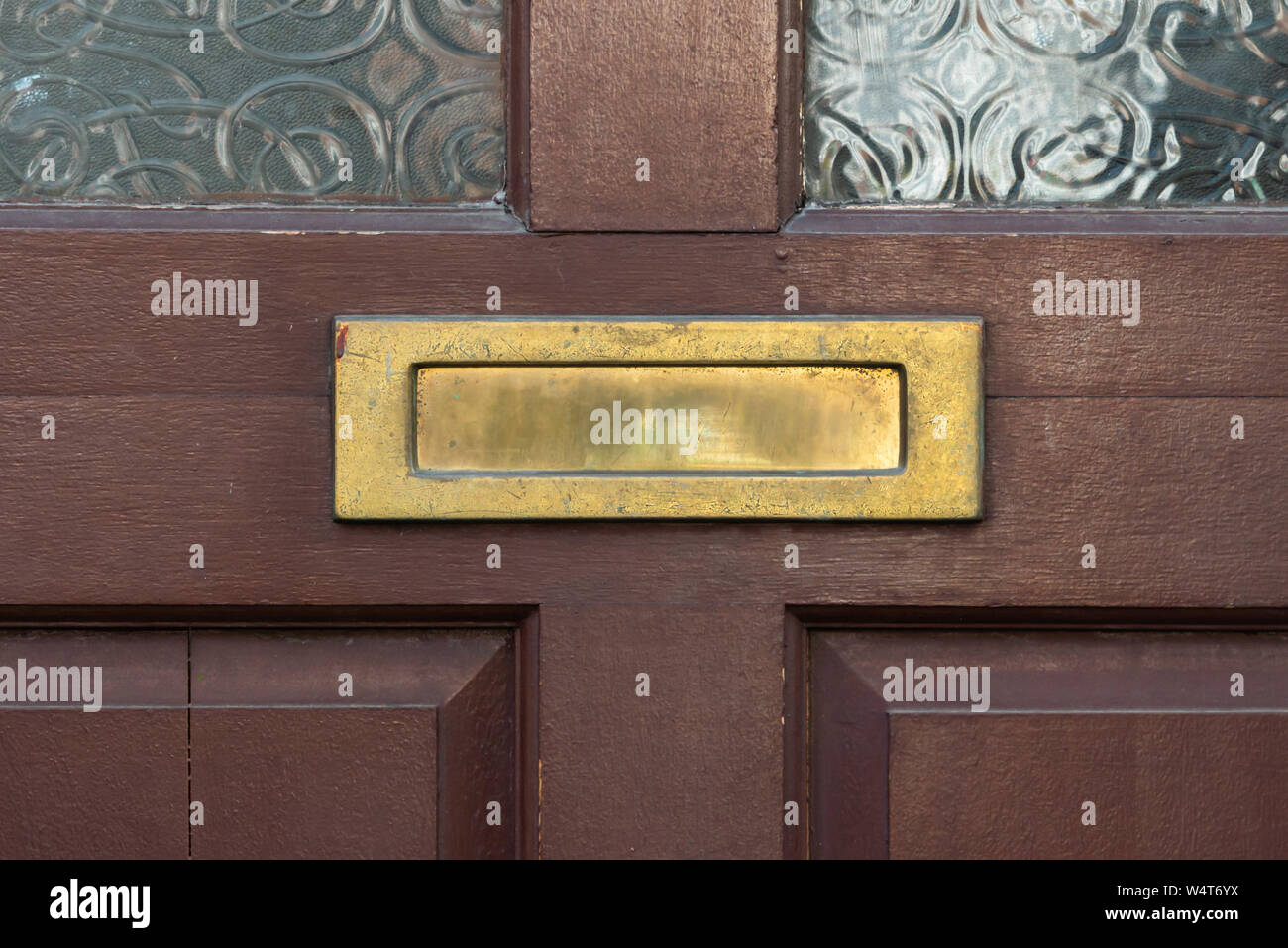 Old letterbox in the door, traditional way of delivering letters to the ...
