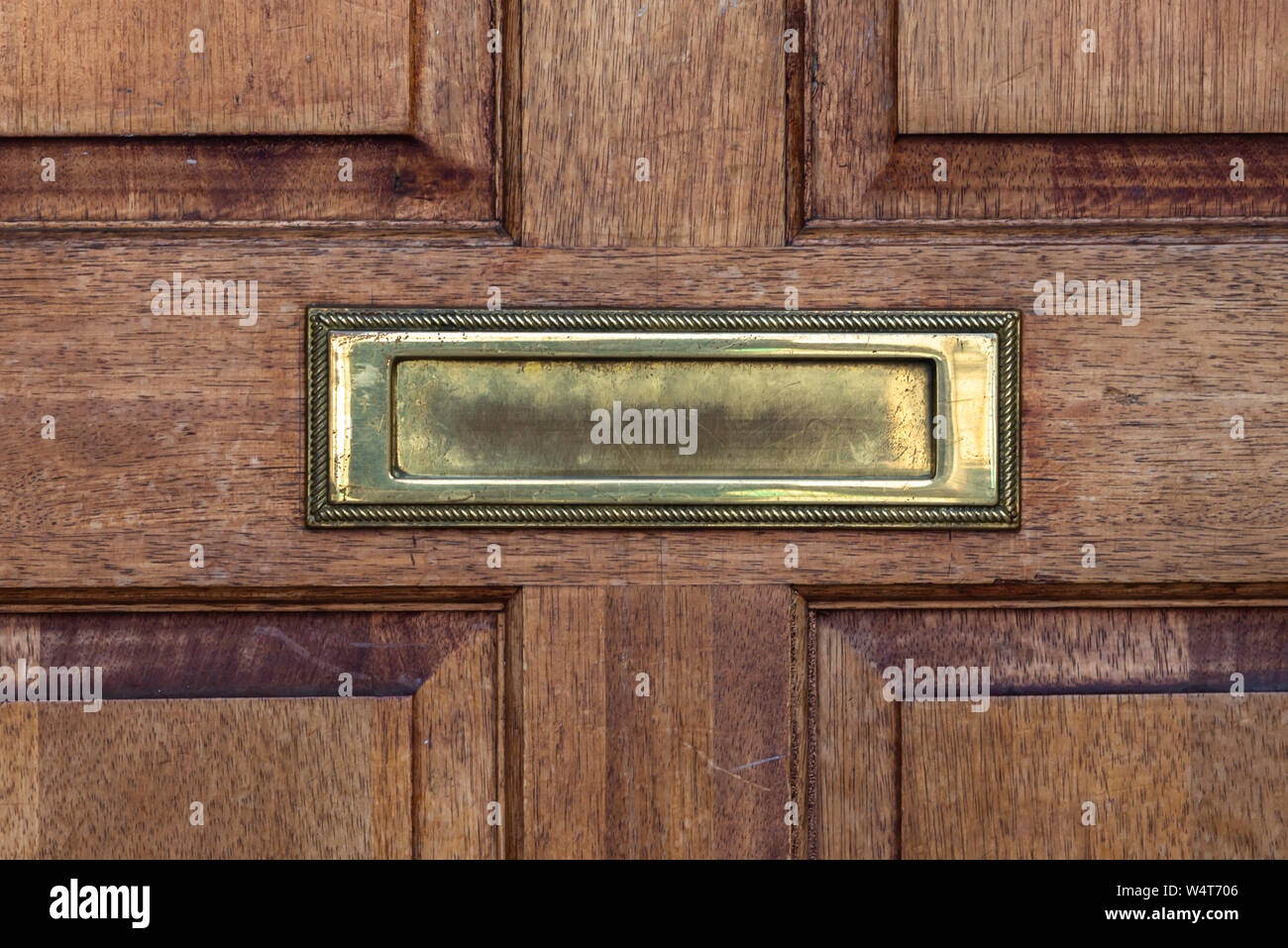 Old letterbox in the door, traditional way of delivering letters to the ...