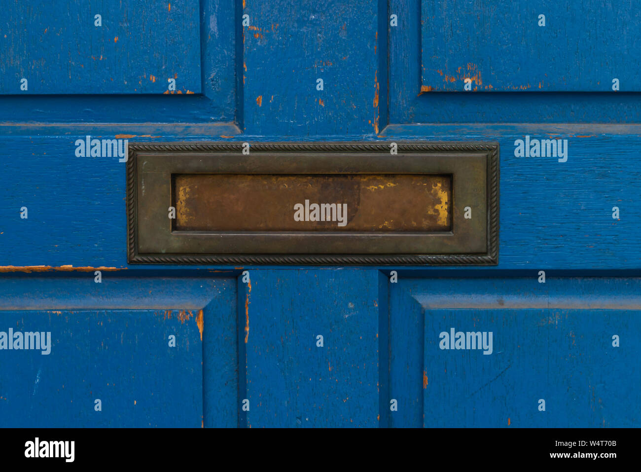 Old letterbox in the door, traditional way of delivering letters to the ...