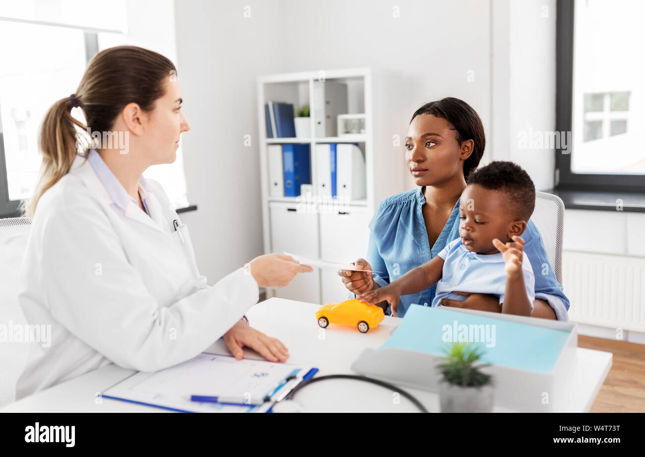 mother with baby son and doctor at clinic Stock Photo - Alamy