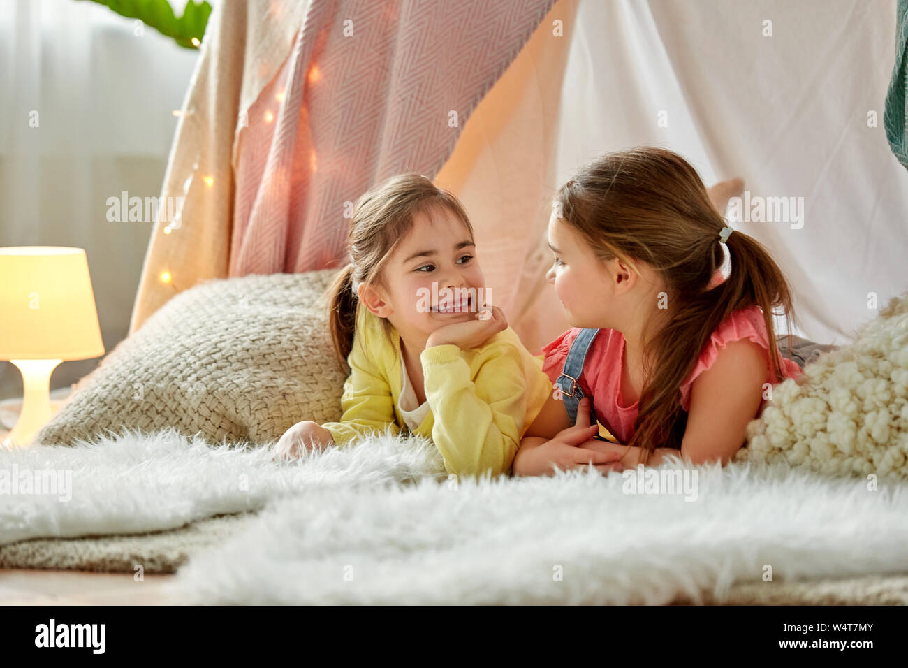 little girls talking in kids tent at home Stock Photo - Alamy