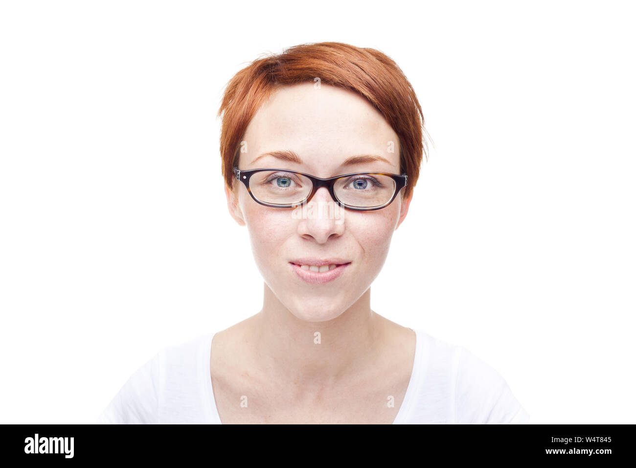 Smiling red head woman on white background Stock Photo - Alamy
