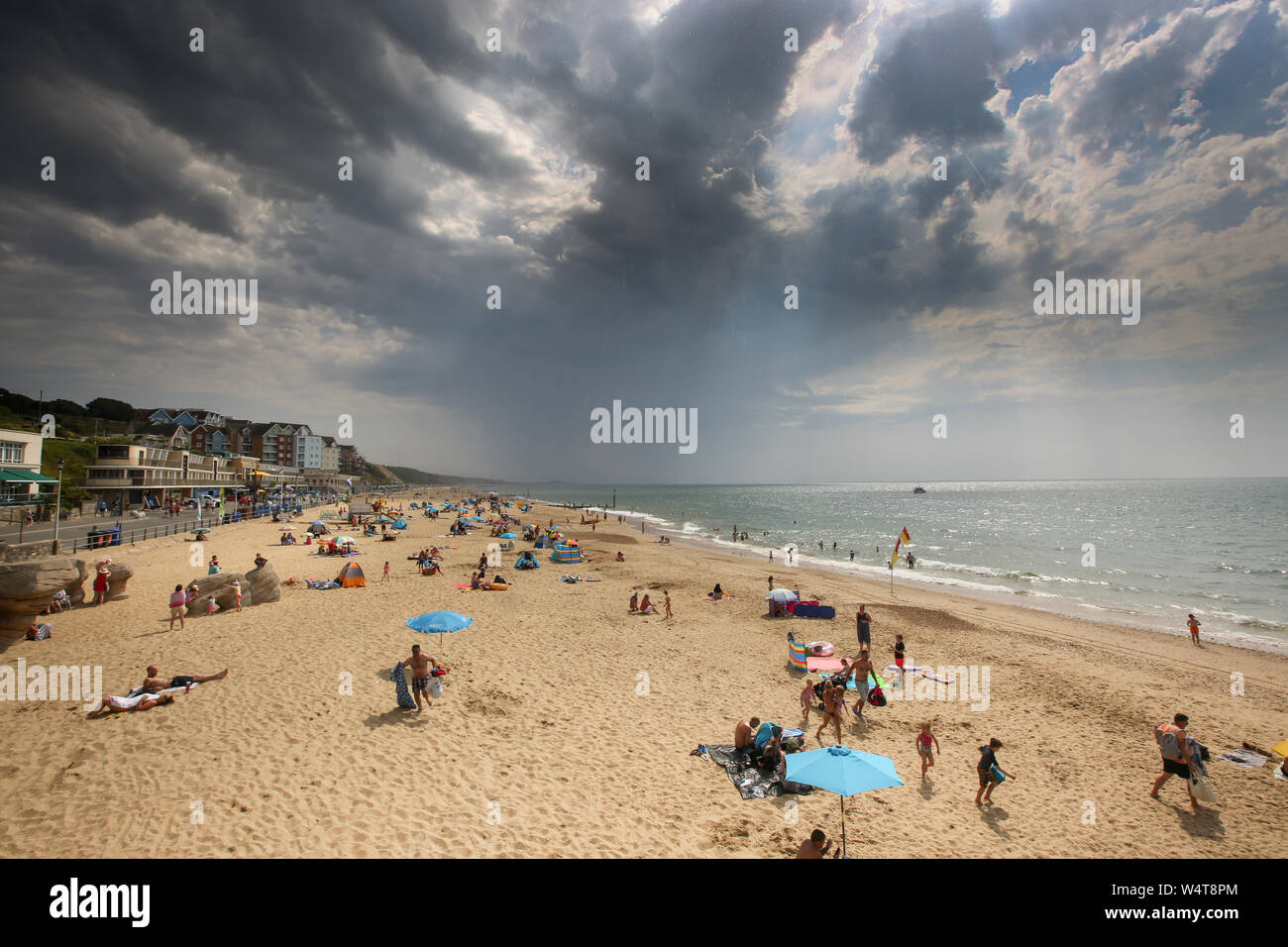 Boscombe , UK. 25th July 2019. Rain clouds interrupt the hottest day on ...