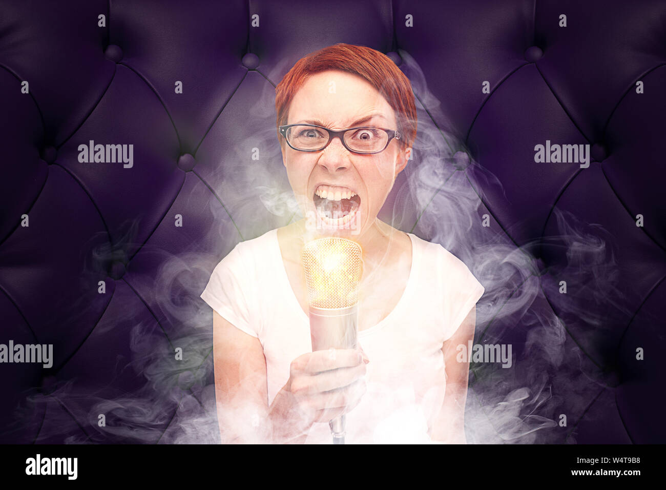 Very angry woman with glowing mic / radio moderator Stock Photo - Alamy