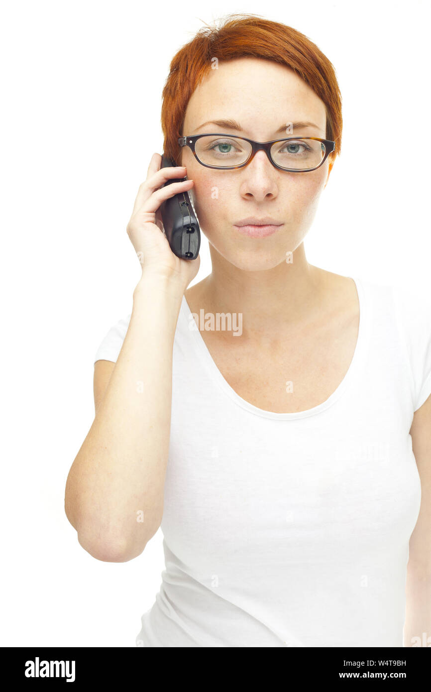 Young woman with phone on white background Stock Photo - Alamy