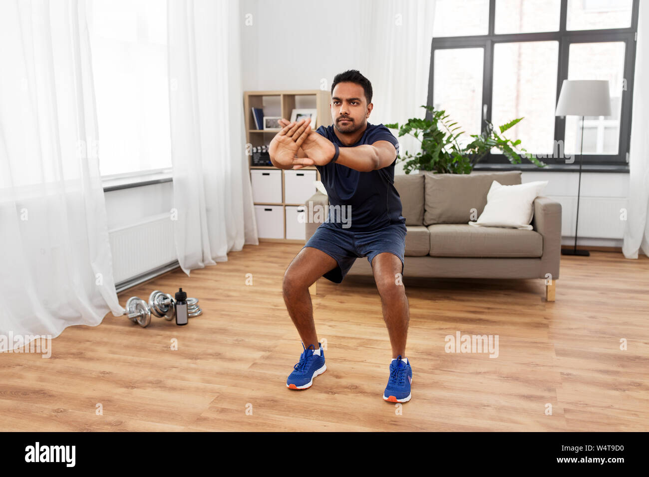 indian man exercising and doing squats at home Stock Photo - Alamy