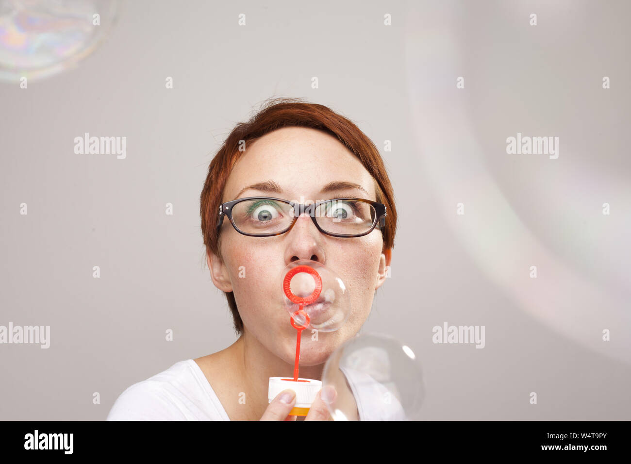 Natural caucasian woman with bubble blower Stock Photo - Alamy