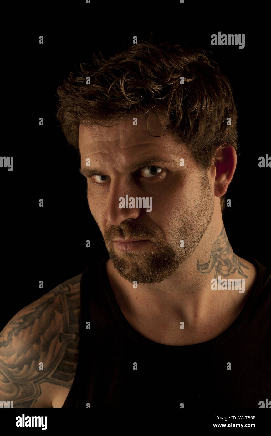 low key portrait of gangster in the darkness Stock Photo - Alamy