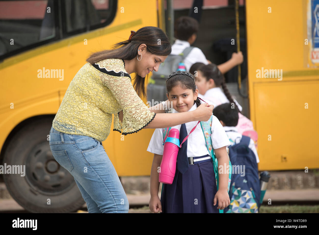 Children talking school bus hi-res stock photography and images - Alamy
