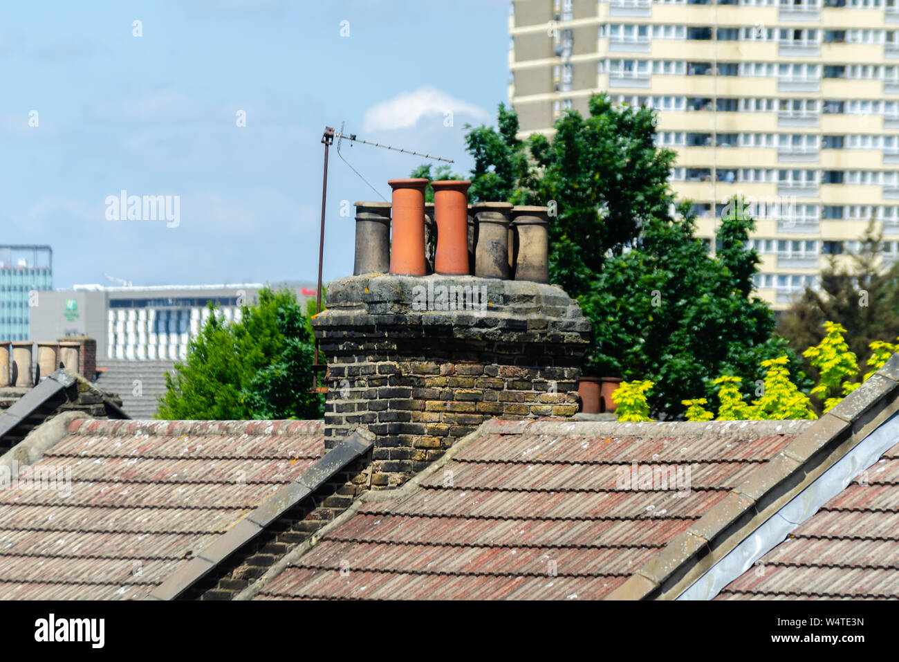 Typical English chimneys on the roofs of London buildings, an element ...